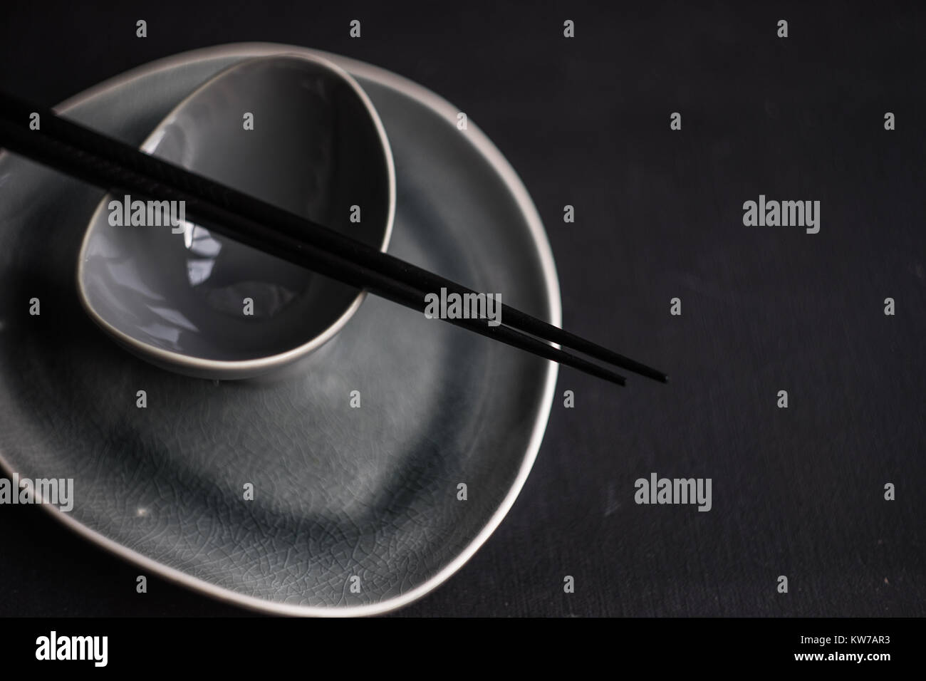 Rustic table set with chopsticks for festive dinner in asian style ...