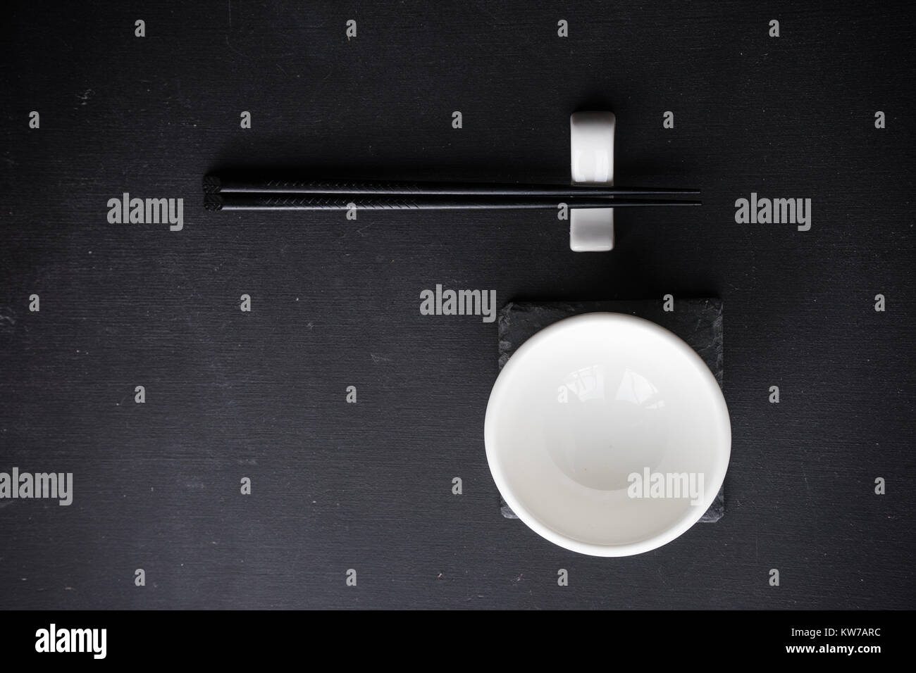 Rustic table set with chopsticks for festive dinner in asian style ...