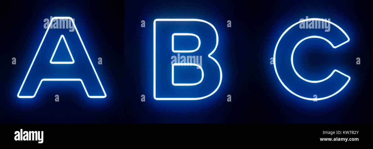 ABC letters glowing on black background Stock Photo - Alamy