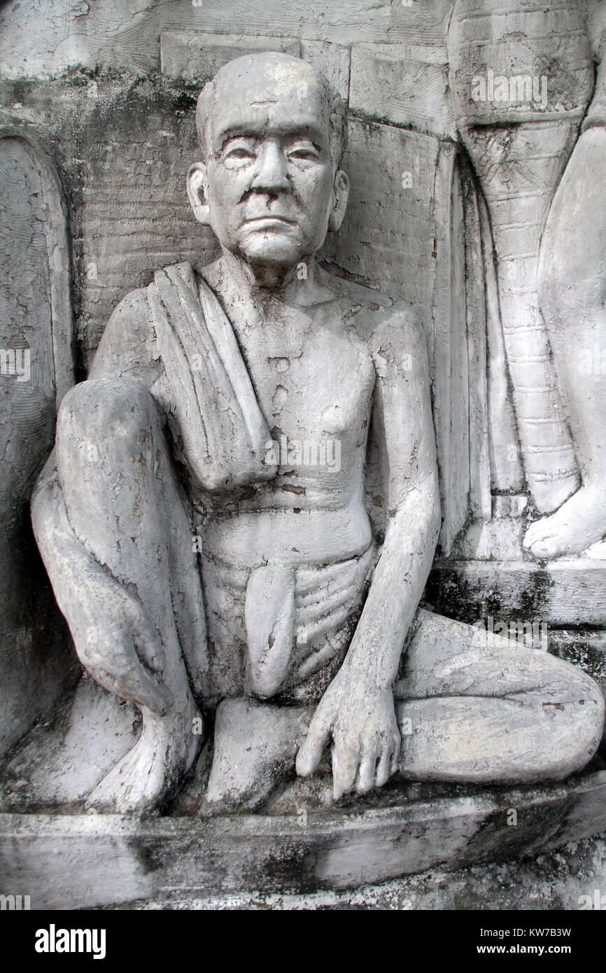 Statue of buddhist monk on the wall of monument in Santichaiprakan Park ...