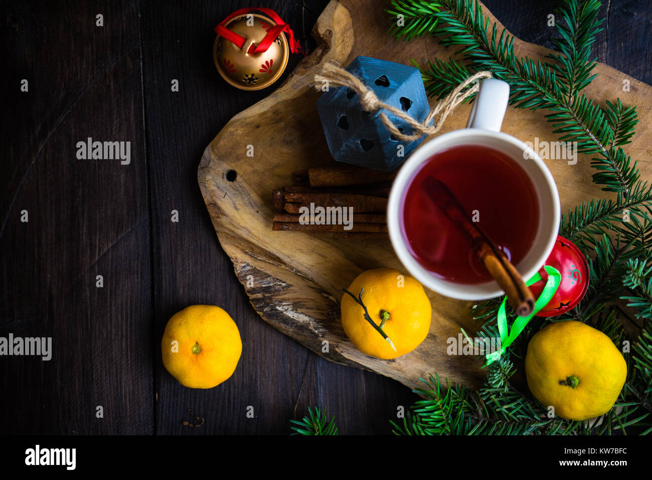 Cup of christmas mulled tea on dark rustic background with festive ...
