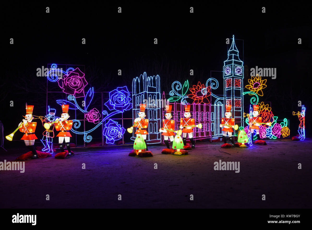 Colourful light display of musicians playing trumpets in London with ...