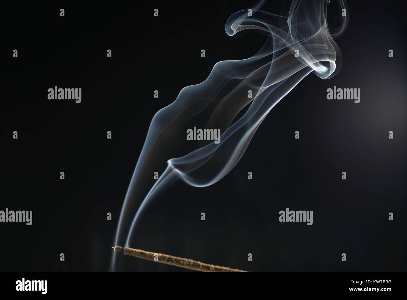 Smoke photographed by an incense stick in the studio Stock Photo - Alamy