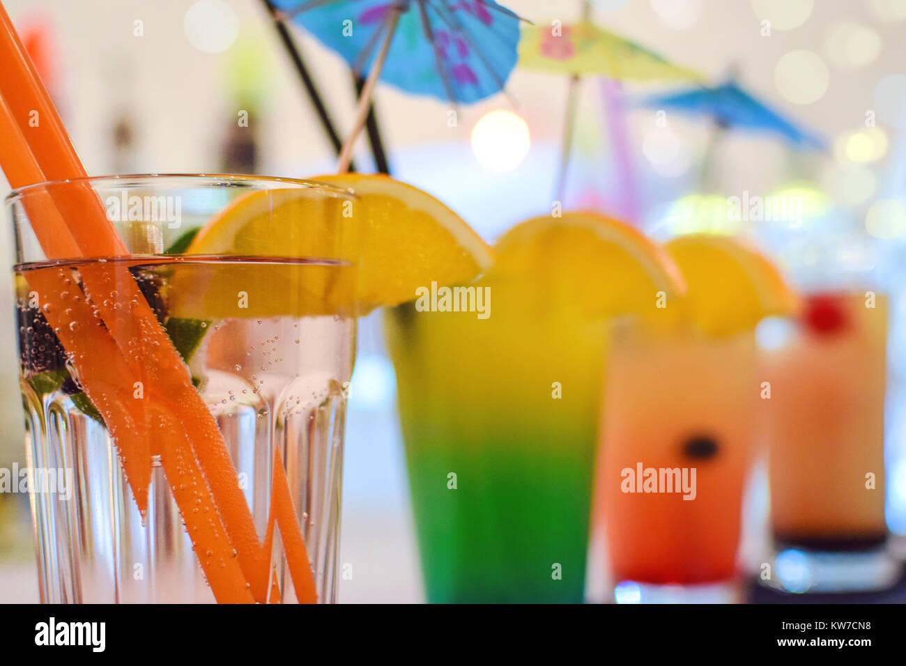 Various multi colored tropical coctail drinks in close-up (very low DOF ...