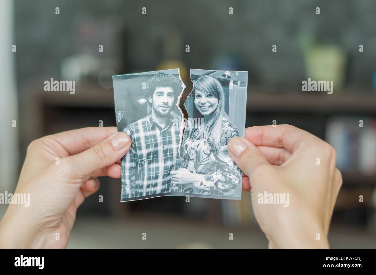 Great concept of divorce, betrayal, separation, woman hand ripping ...