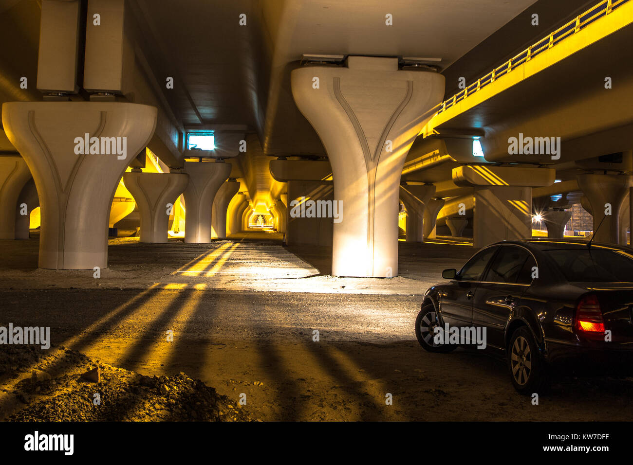 A car under a bridge at night Stock Photo - Alamy