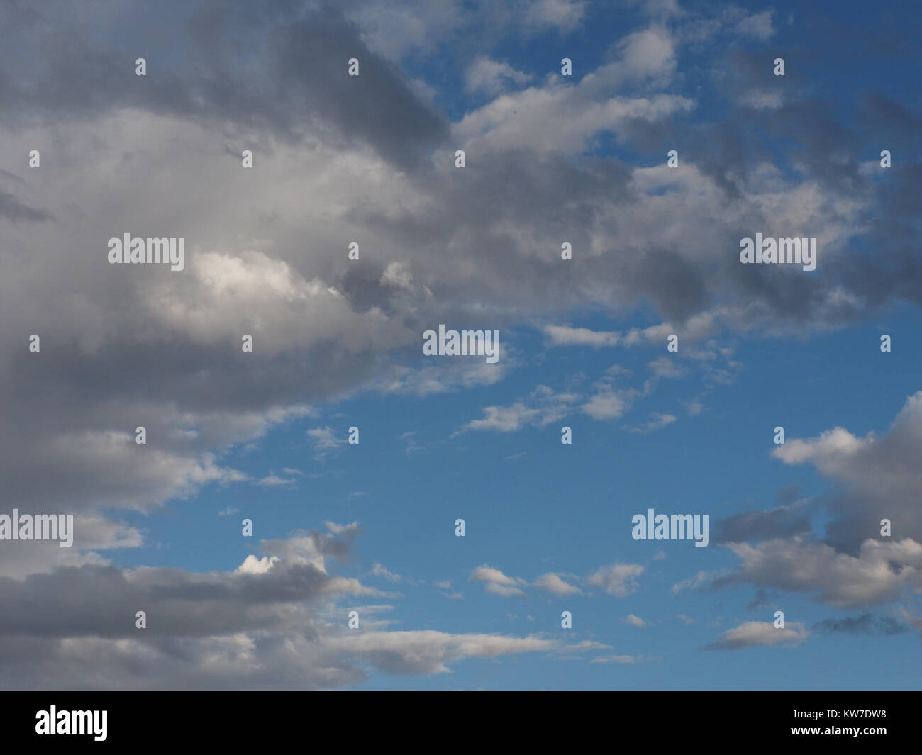 Gray cumulus clouds in the blue sky Stock Photo - Alamy