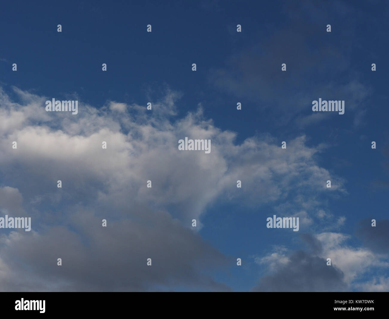 Abstract white cloud with blurred borders and translucent edges on a ...