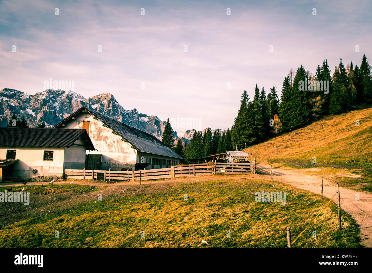 Alpine hut with a bench in the italian alps Stock Photo - Alamy