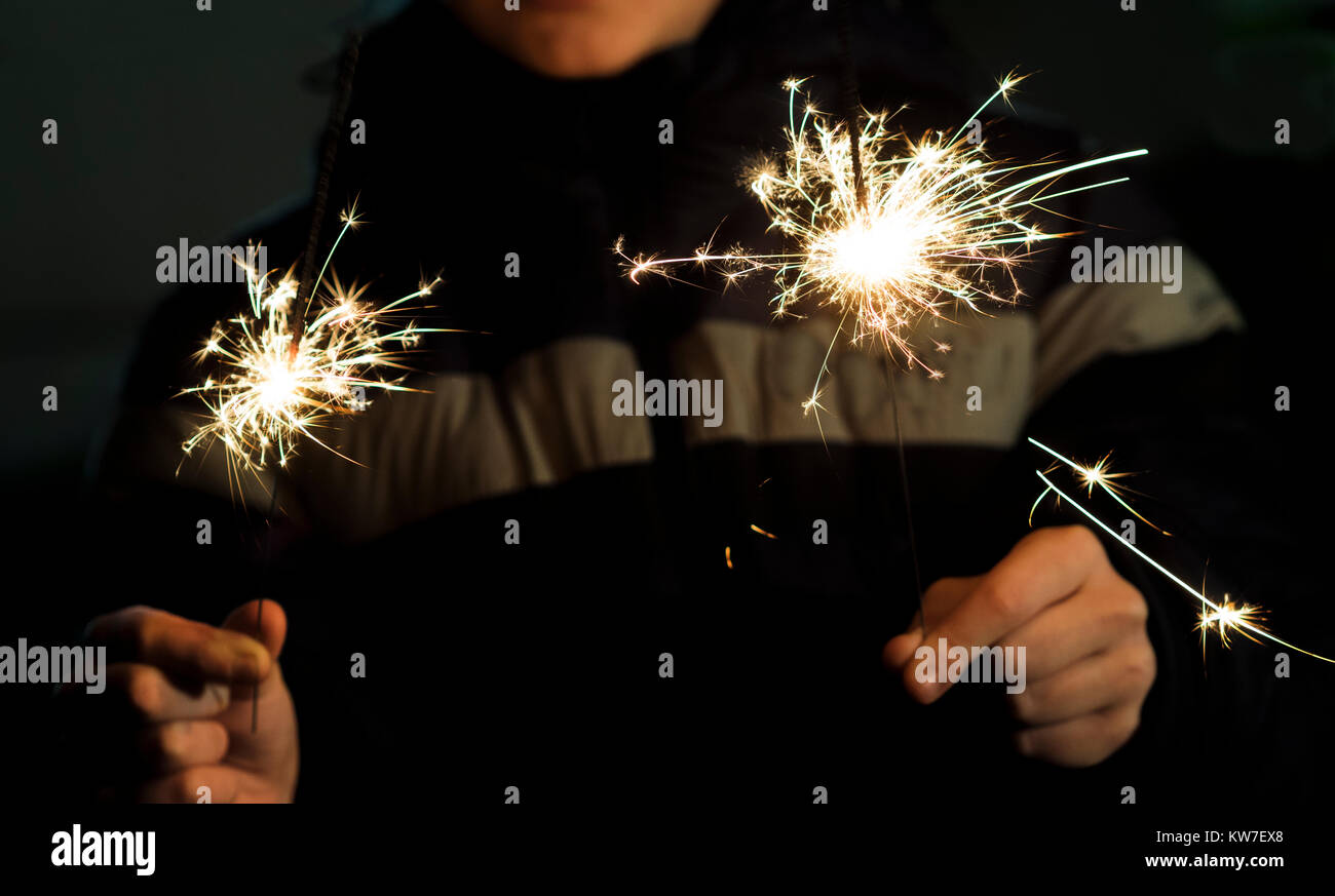Happy caucasian boy with sparkler in his hands Stock Photo - Alamy