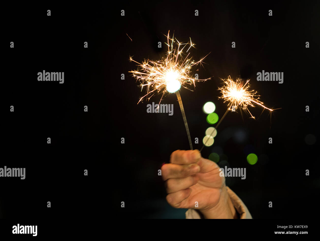 beautiful sparkler in woman hand Stock Photo - Alamy