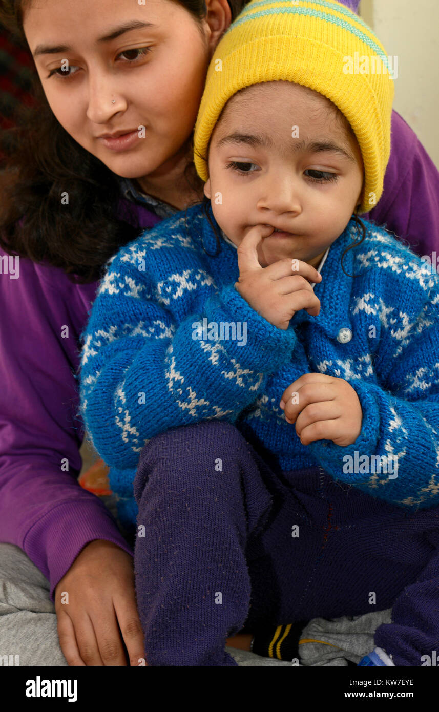 Cuddling with baby Stock Photo - Alamy