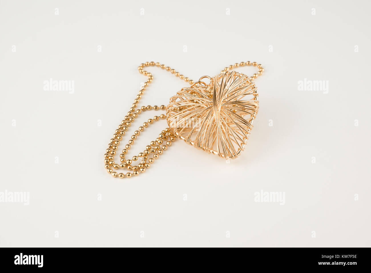 Decoration in the form of a heart made of wire isolated on white ...