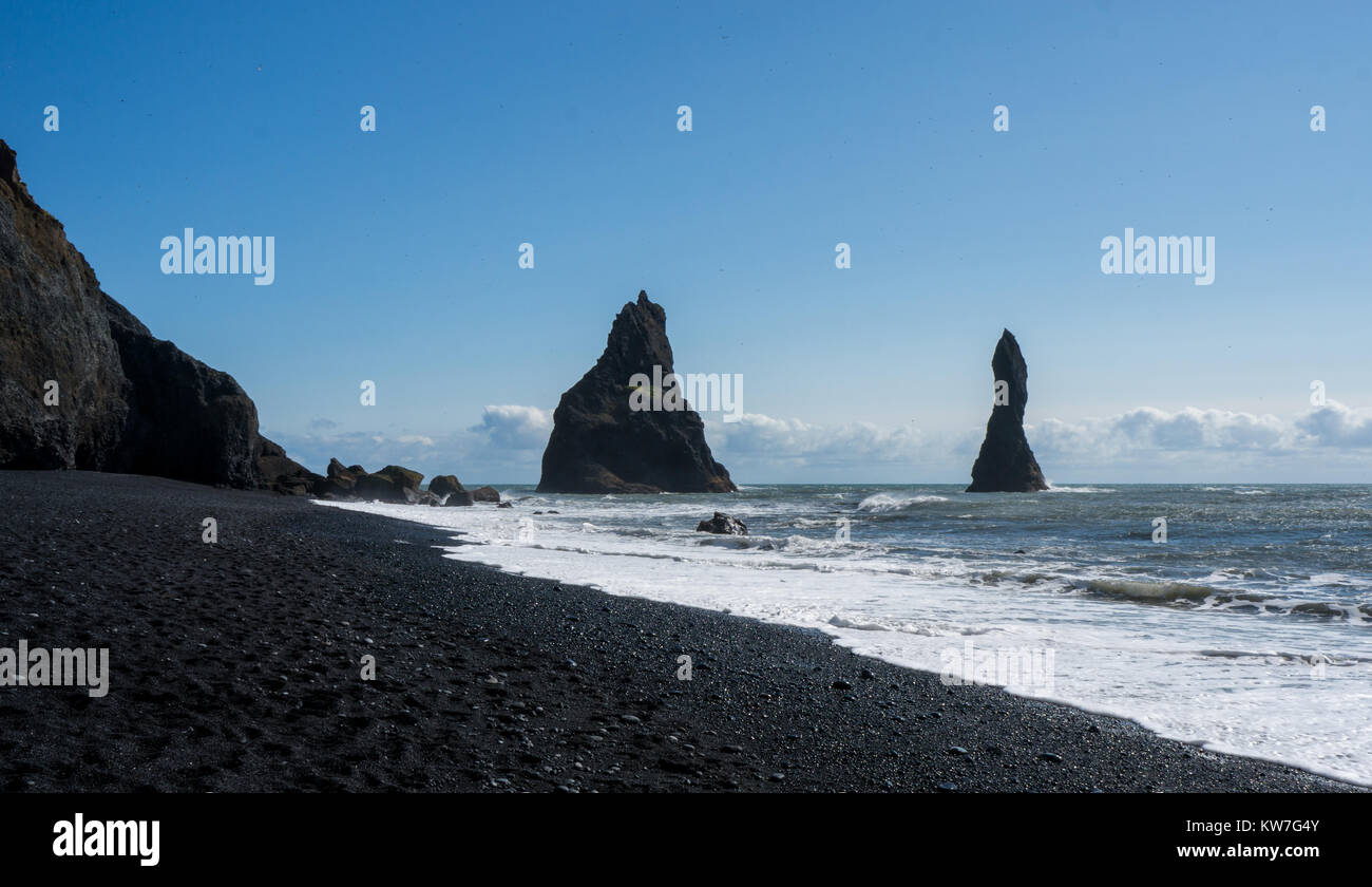 Famous Reynisdrangar rock formations at black Reynisfjara Beach. Coast ...