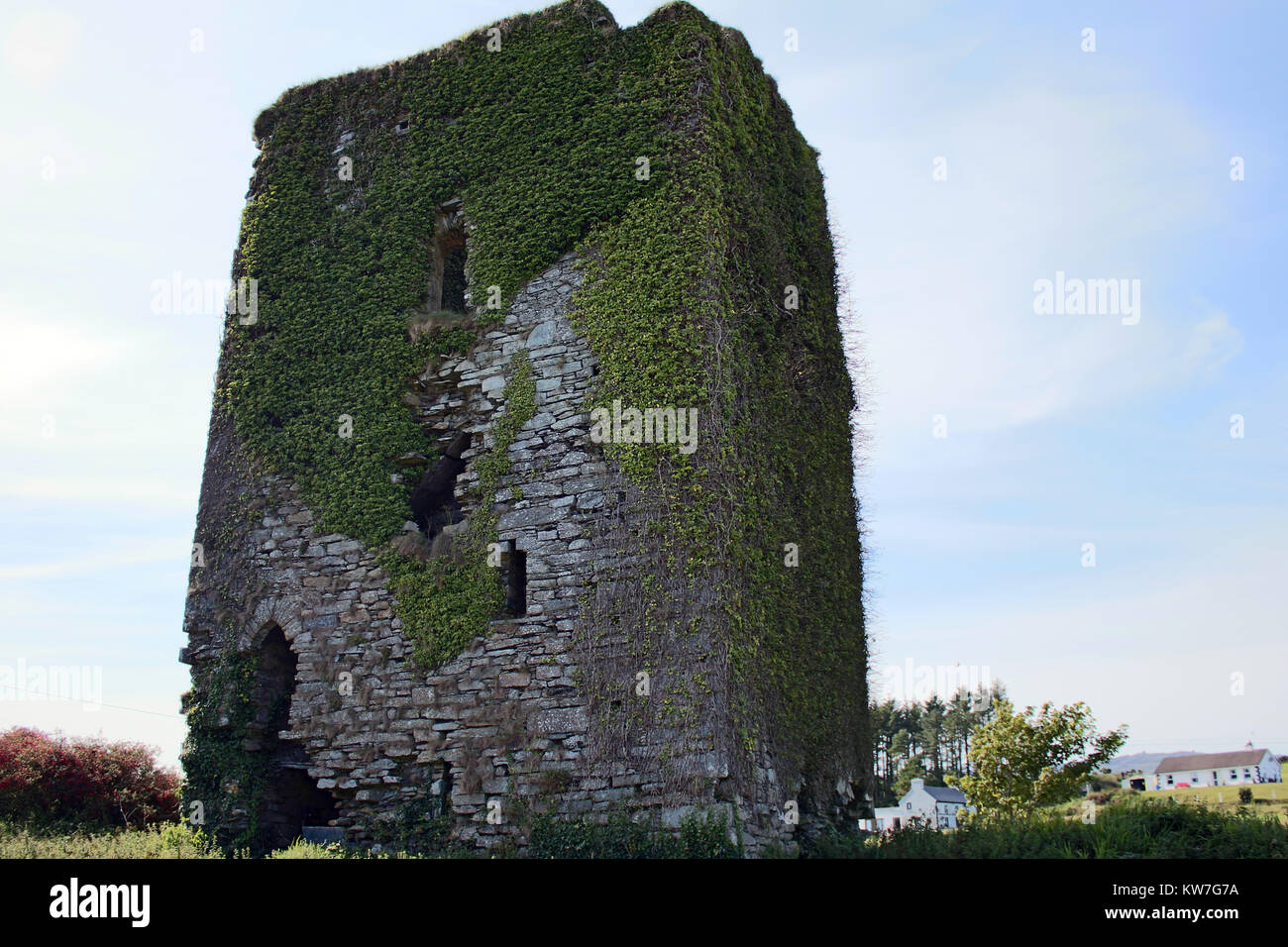 Old Irish Castle balancing on the cliffs of the Coastline overlooking ...