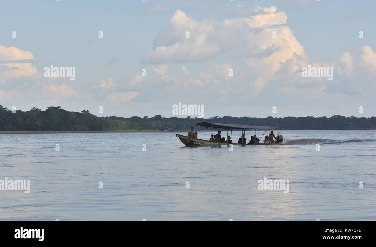 A fast ferry or water bus speeds along the Napo River near Coca or ...