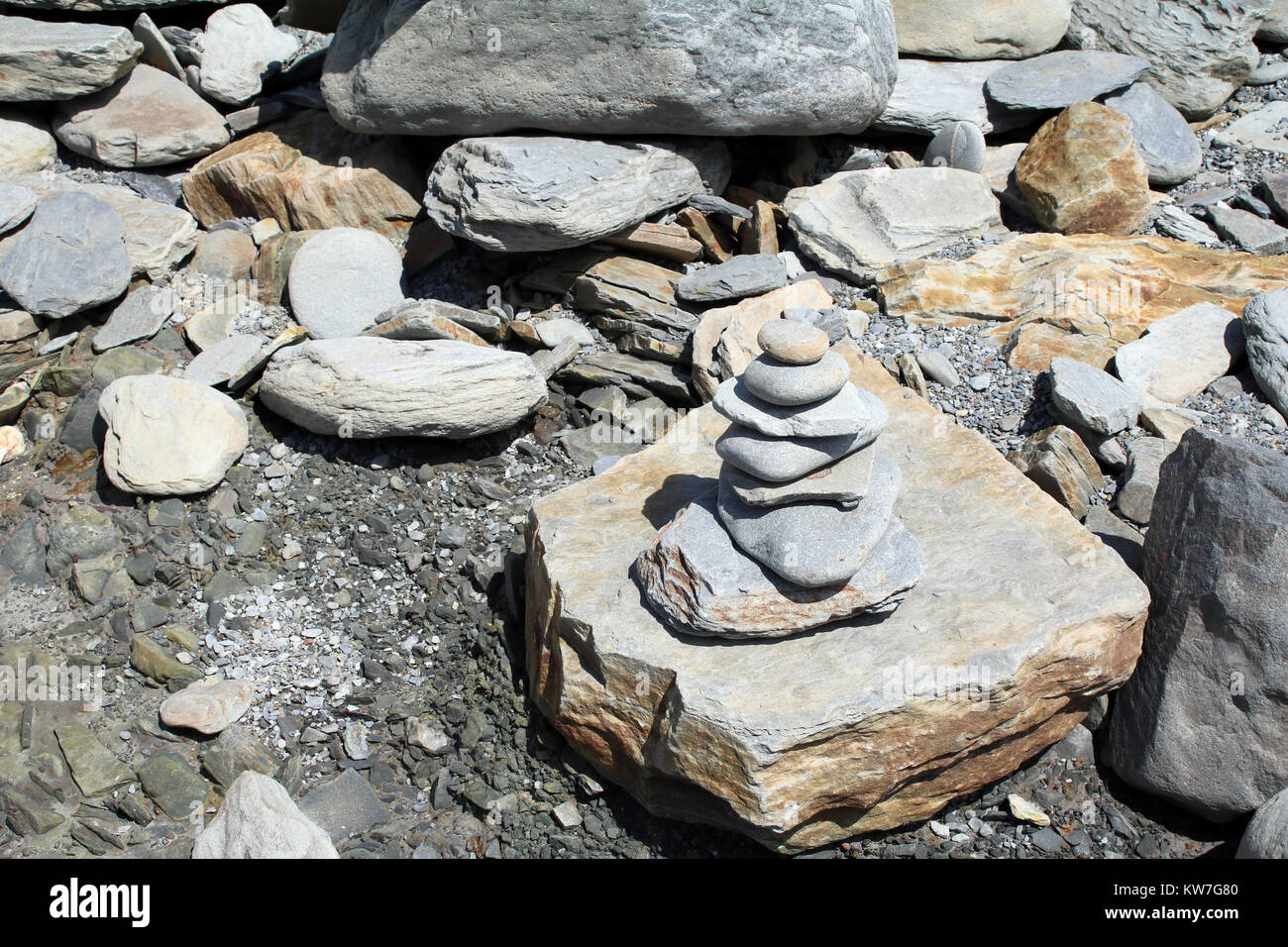 A peaceful standing of stones near a rocky beach Stock Photo - Alamy