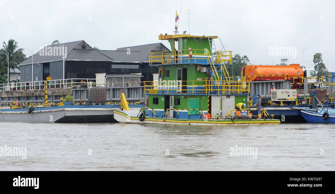A three decked tug boat at a dock on the Napo River near Coca or Puerto ...