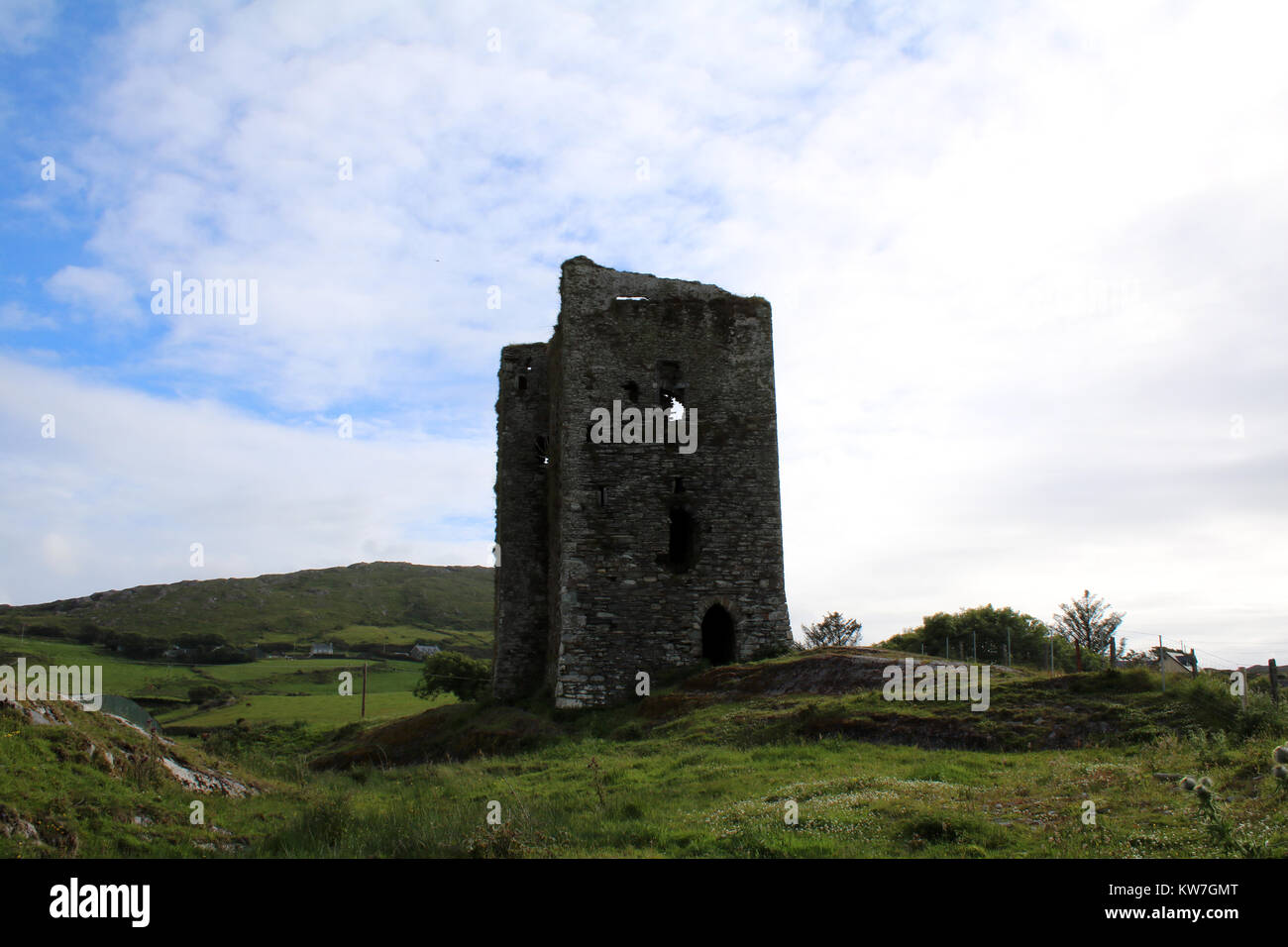 Old Irish Castle balancing on the cliffs of the Coastline overlooking ...