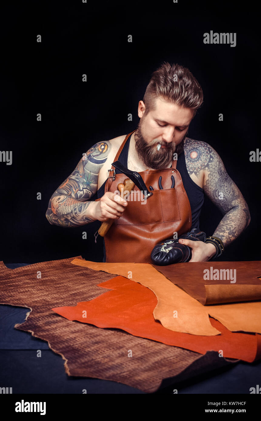 Portrait of shoemaker hammering on a shoe Stock Photo - Alamy