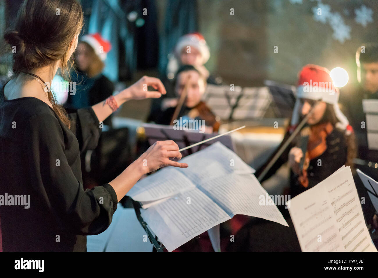 girl conductor conducting orchestra Stock Photo - Alamy