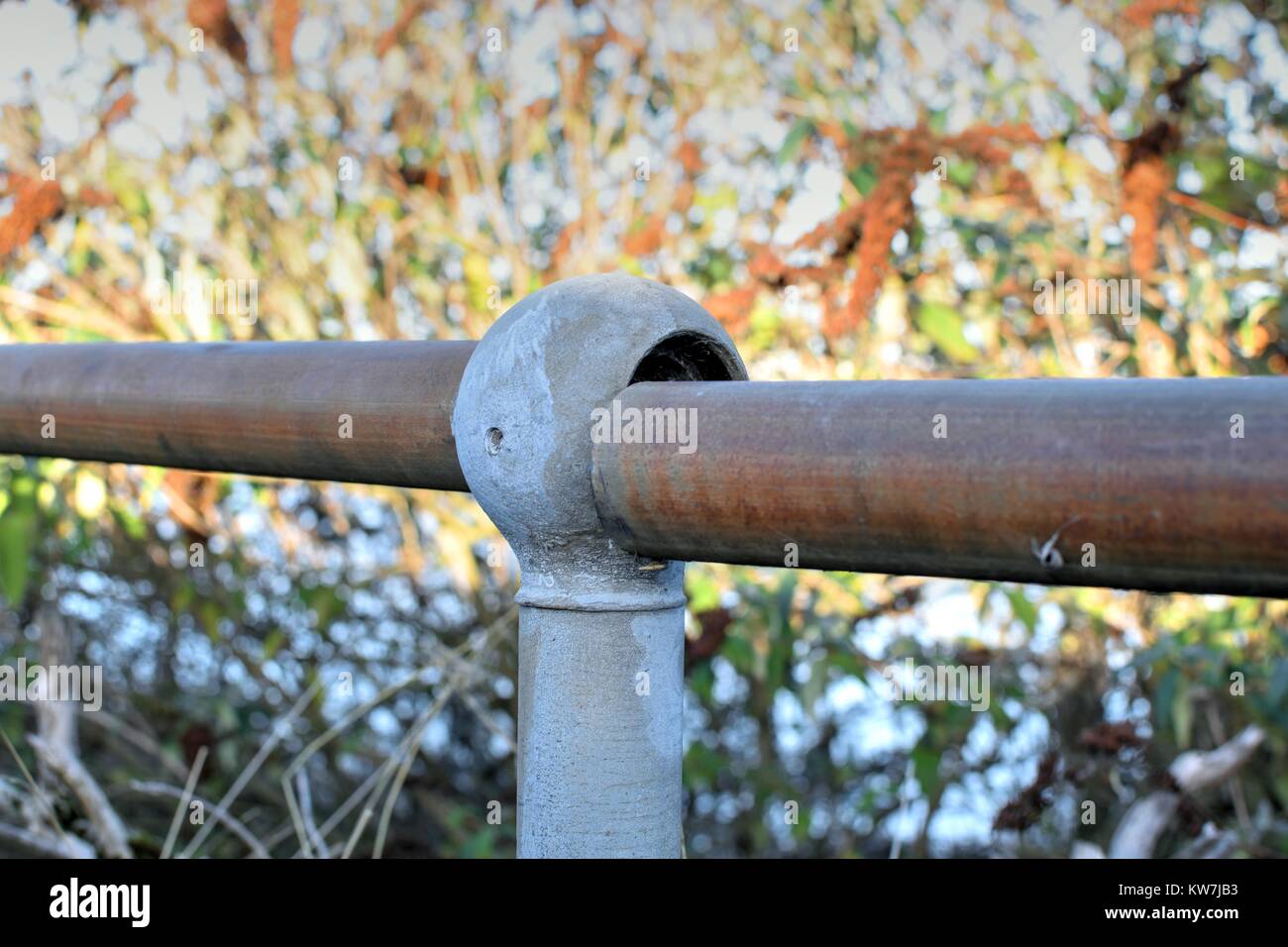 Bar fence with section slightly misaligned and not fully connected ...