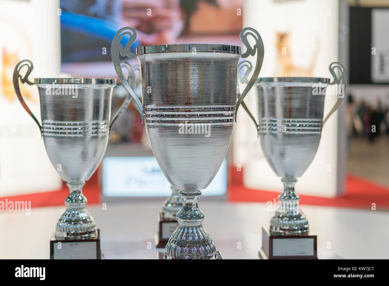 three large shiny cups for rewarding Stock Photo - Alamy