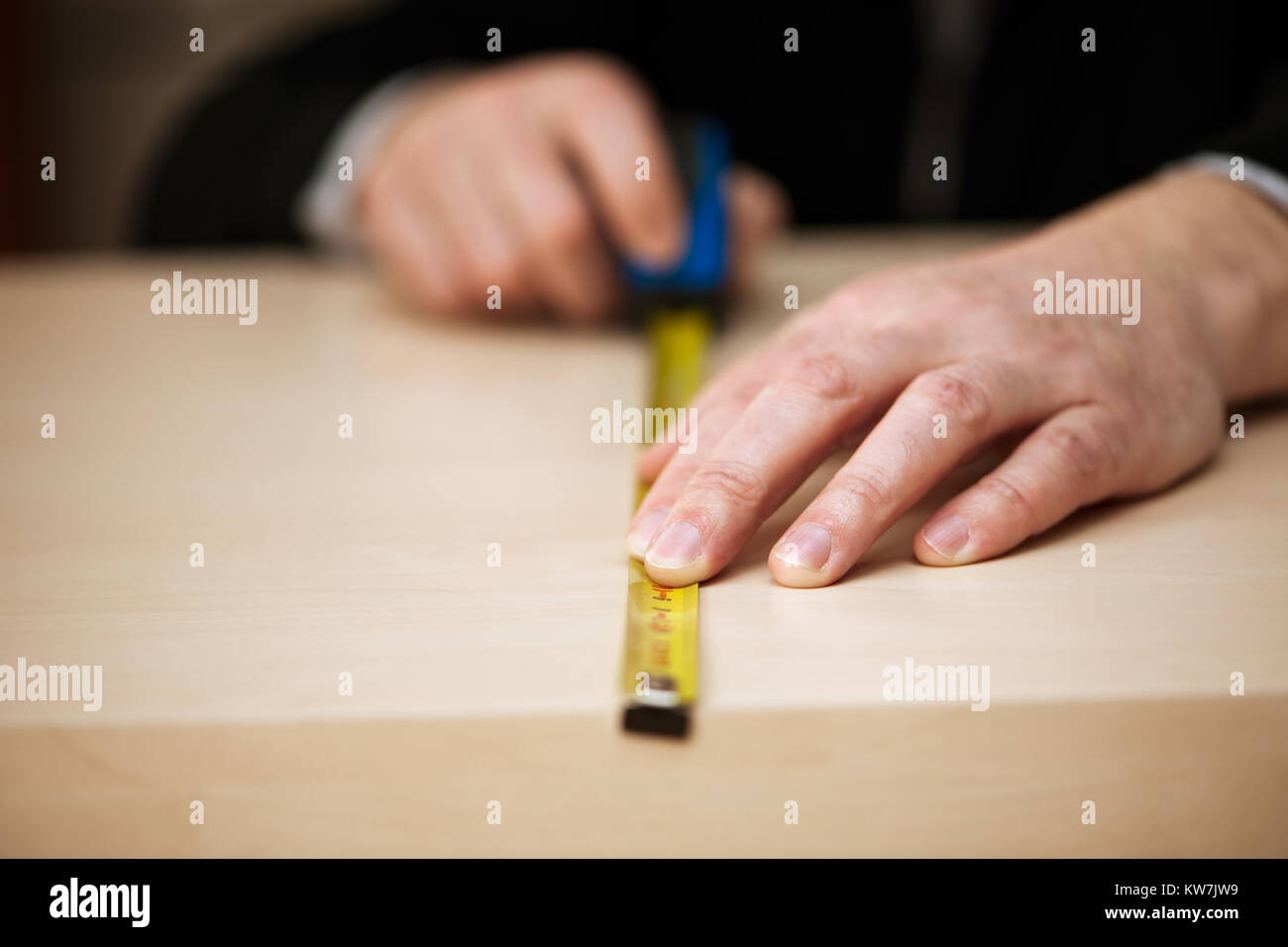 Man using tape measure Stock Photo - Alamy Man using tape measure Stock Photo - Alamy