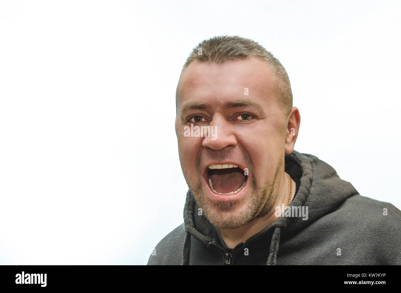 screaming man looking at the camera Stock Photo - Alamy