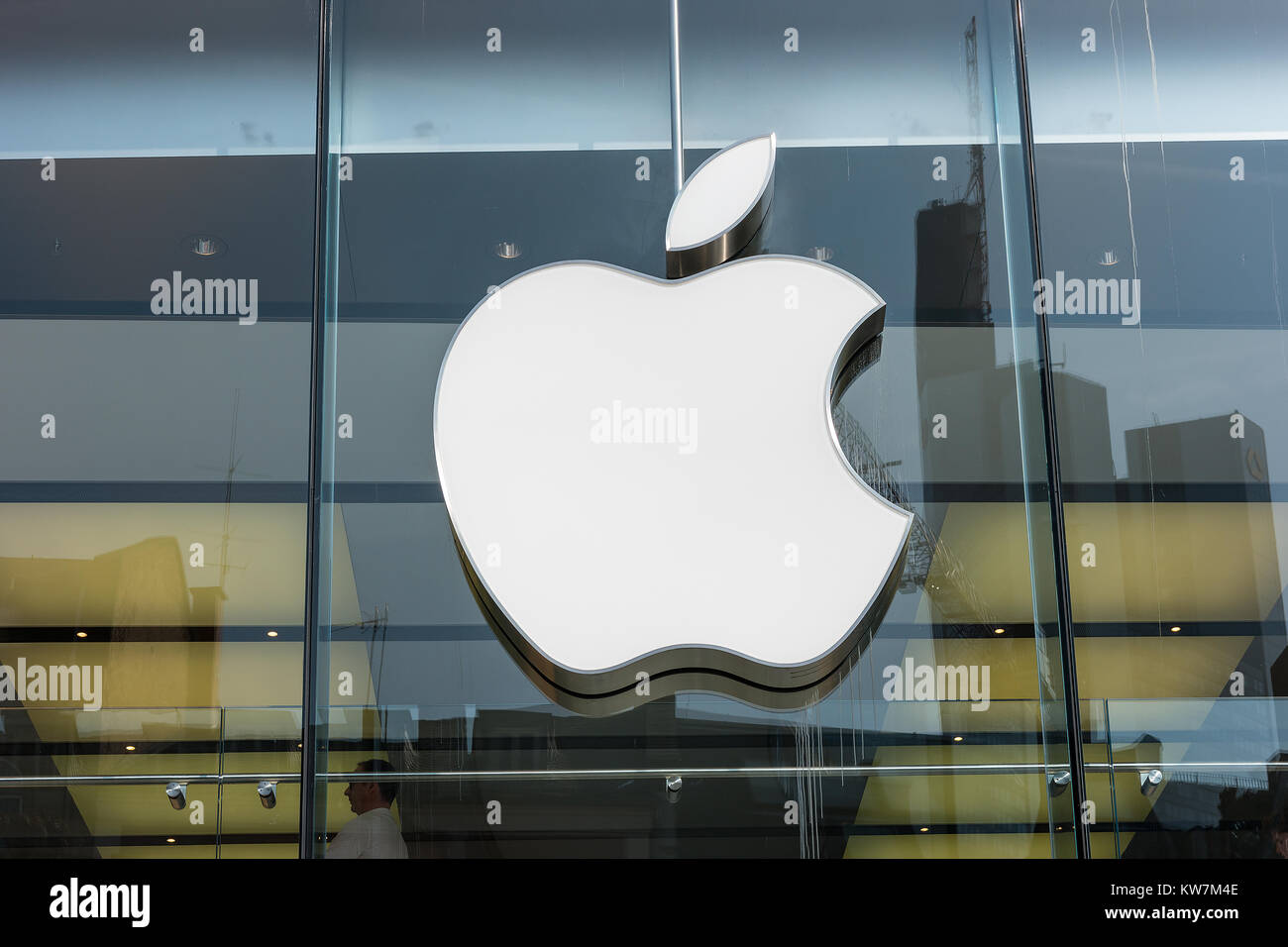 Apple sign on a Apple store. Apple is the multinational technology ...