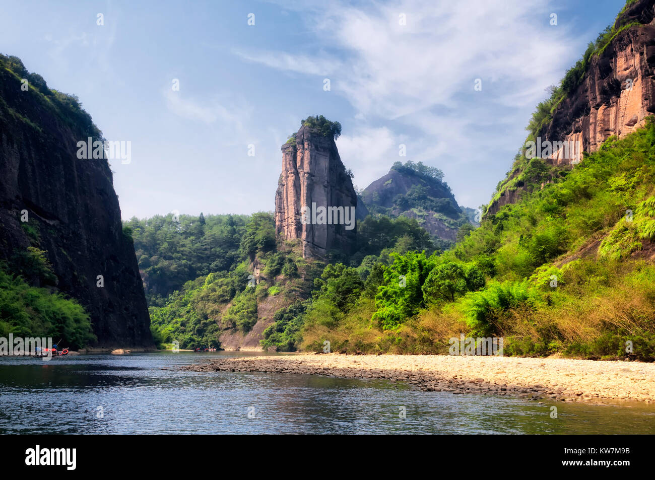 A rocky shore on the nine bend river or Jiuxi in Wuyishan or Mount wuyi ...