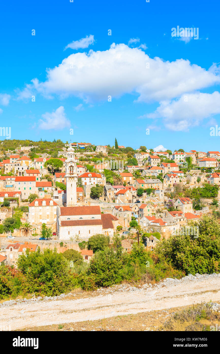 View of Lozisca village with colorful houses and church, Brac island ...