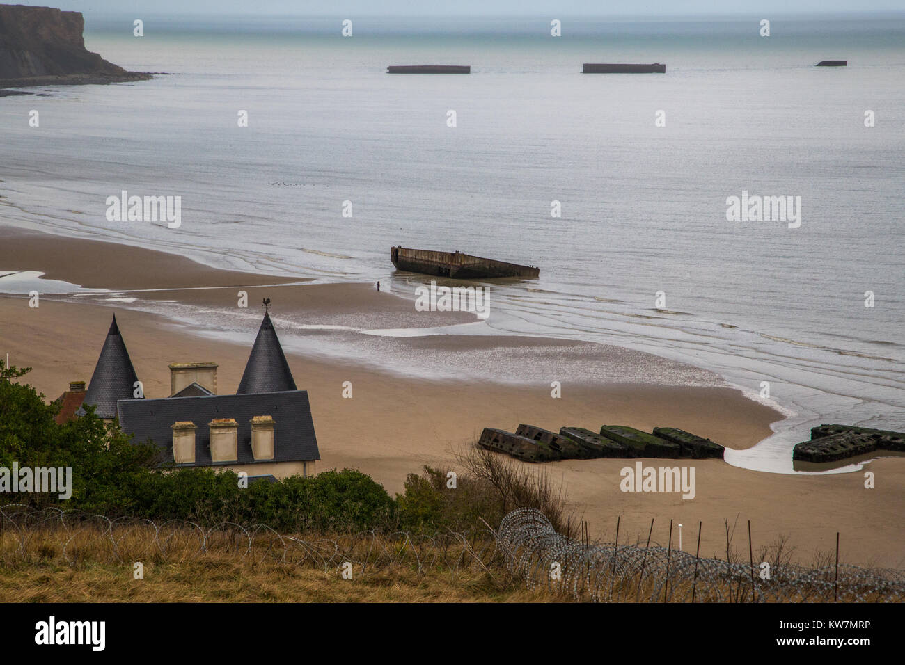 The beach at Arromanches les Bains showing the remains of the wartime ...