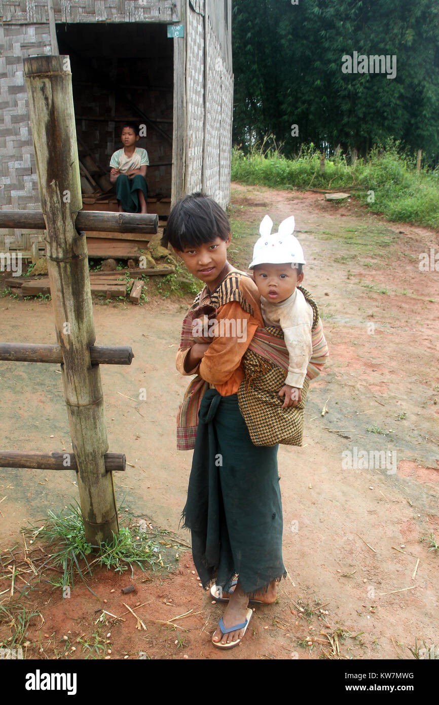Two girls on the stree in village, Myanmar Stock Photo - Alamy