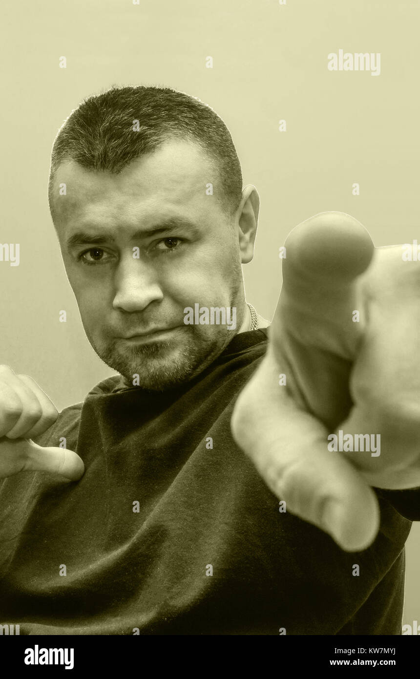 sad man is pointing his finger at the camera on green and white Stock ...