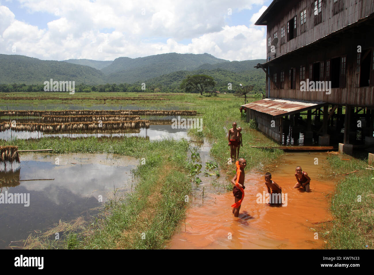 Young monks sitting by temple hi-res stock photography and images - Alamy