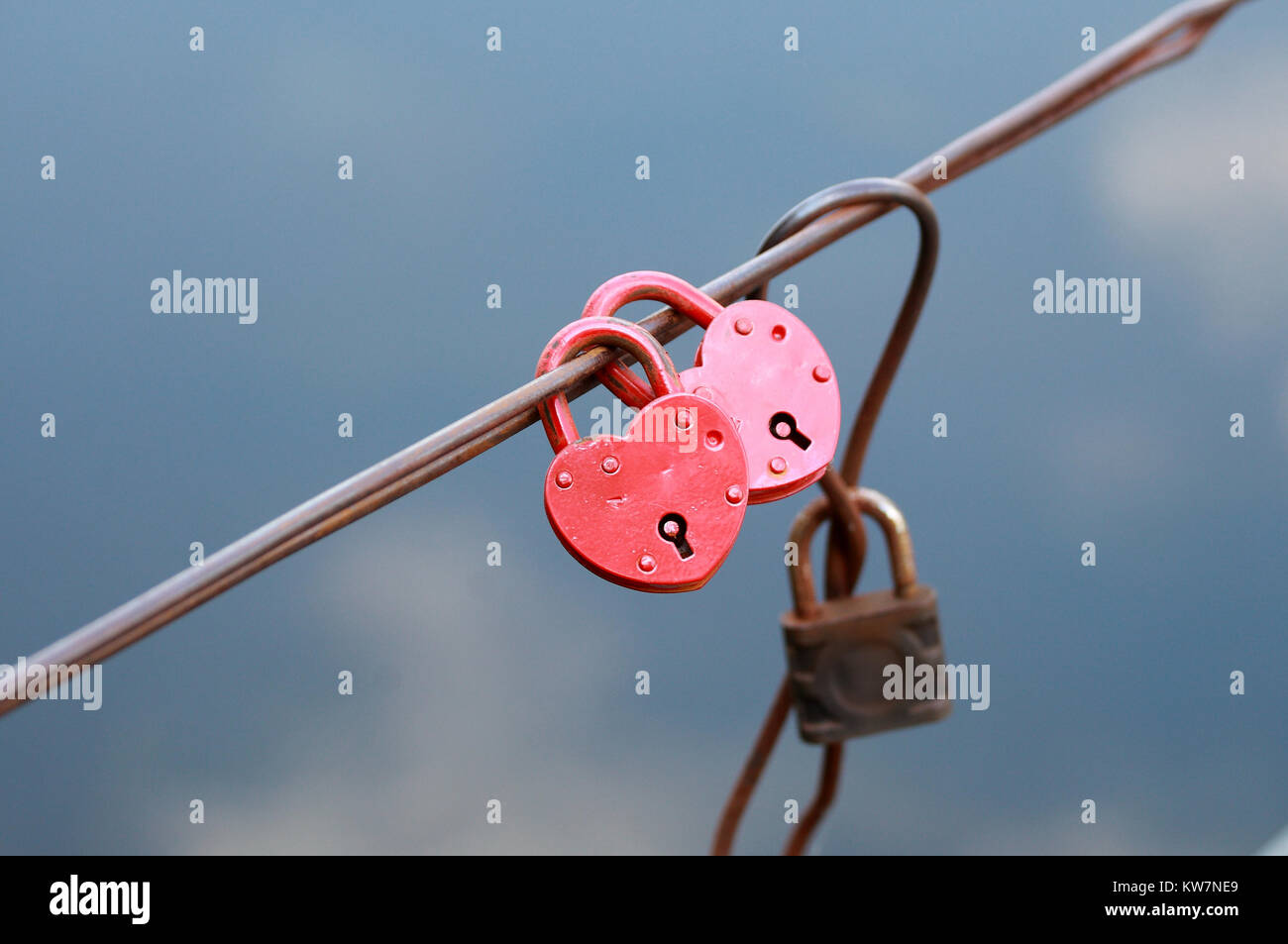 Two pink castle in the form of heart hanging on a wire Stock Photo - Alamy
