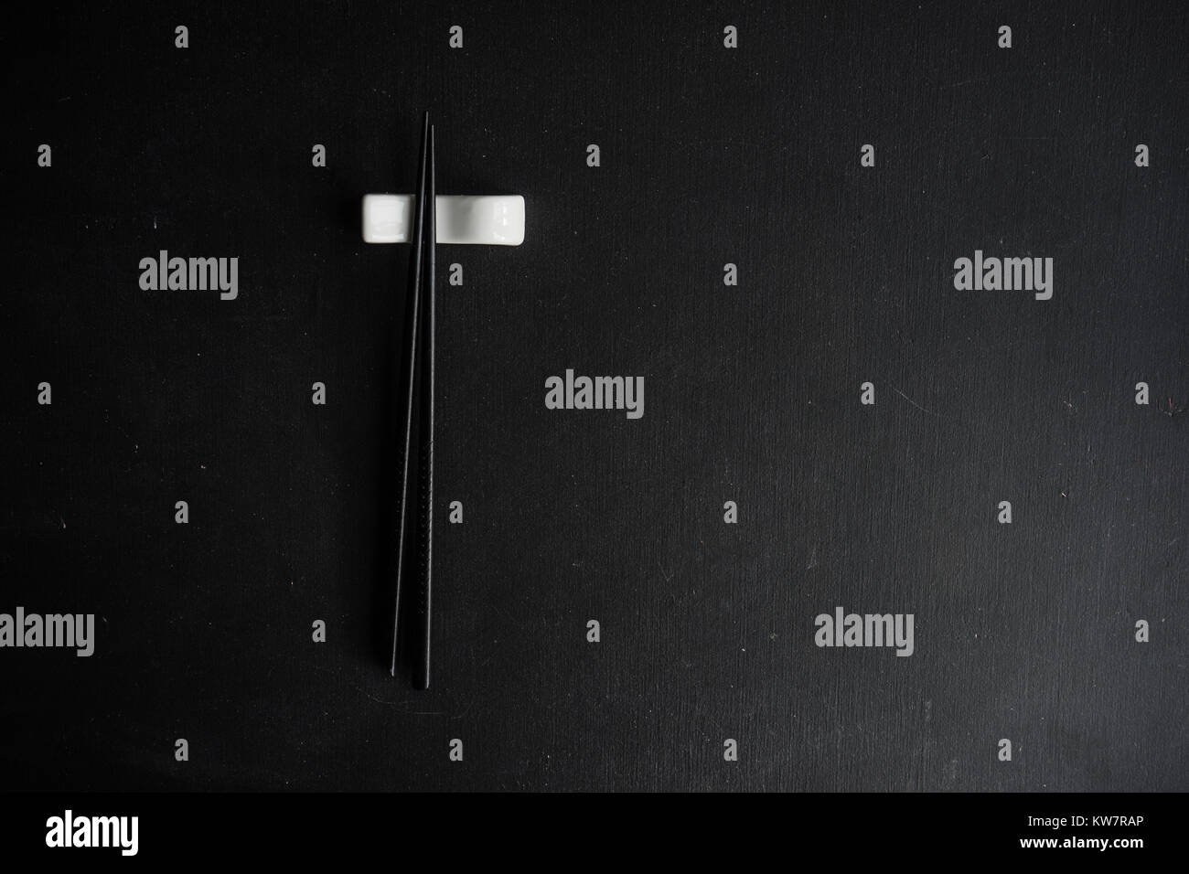 Rustic table set with chopsticks for festive dinner in asian style ...