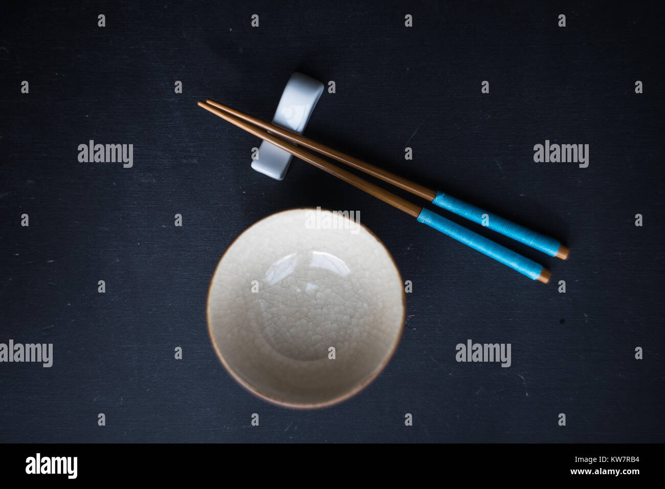 Rustic table set with chopsticks for festive dinner in asian style ...