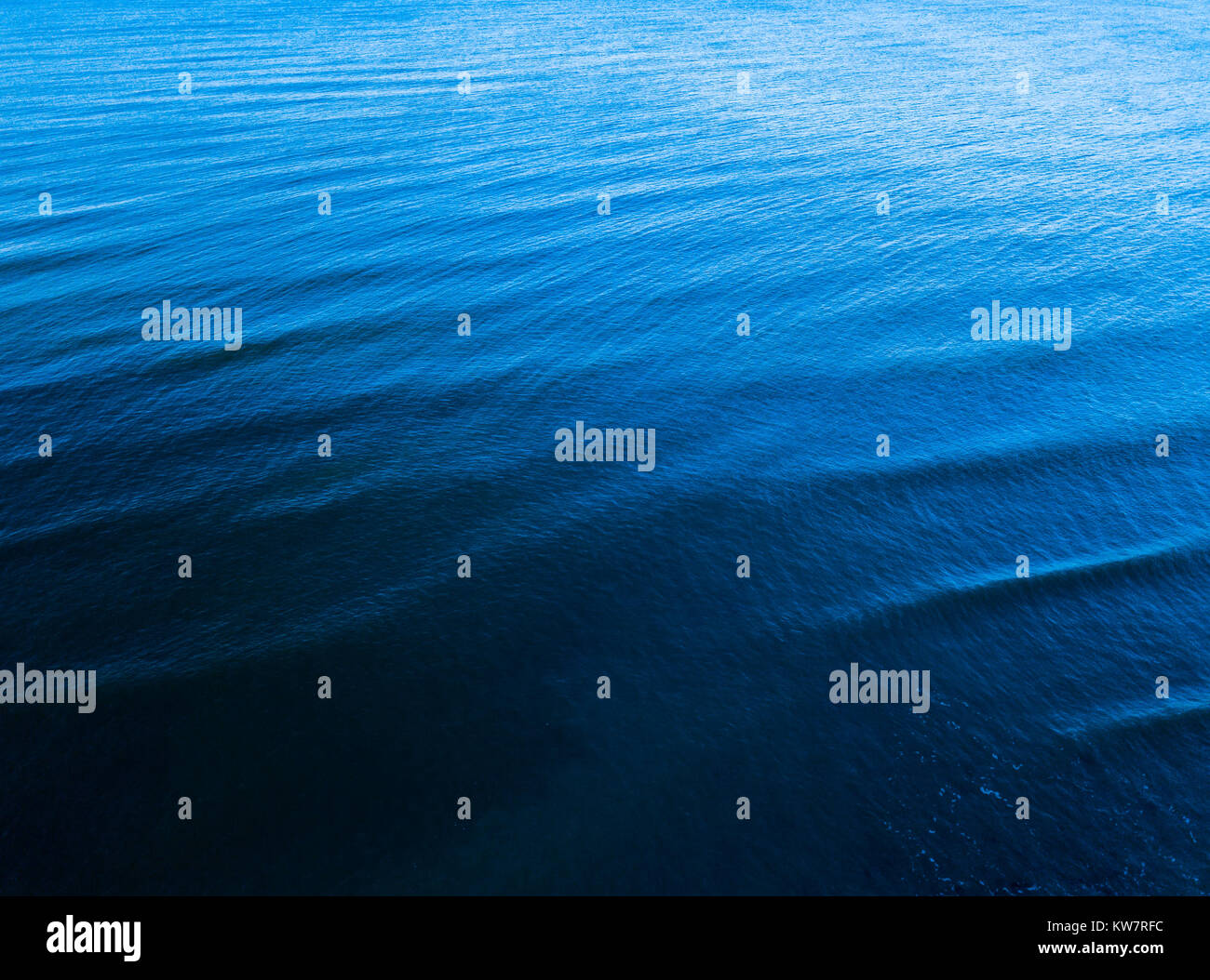 Aerial top view of blue sea surface Stock Photo - Alamy