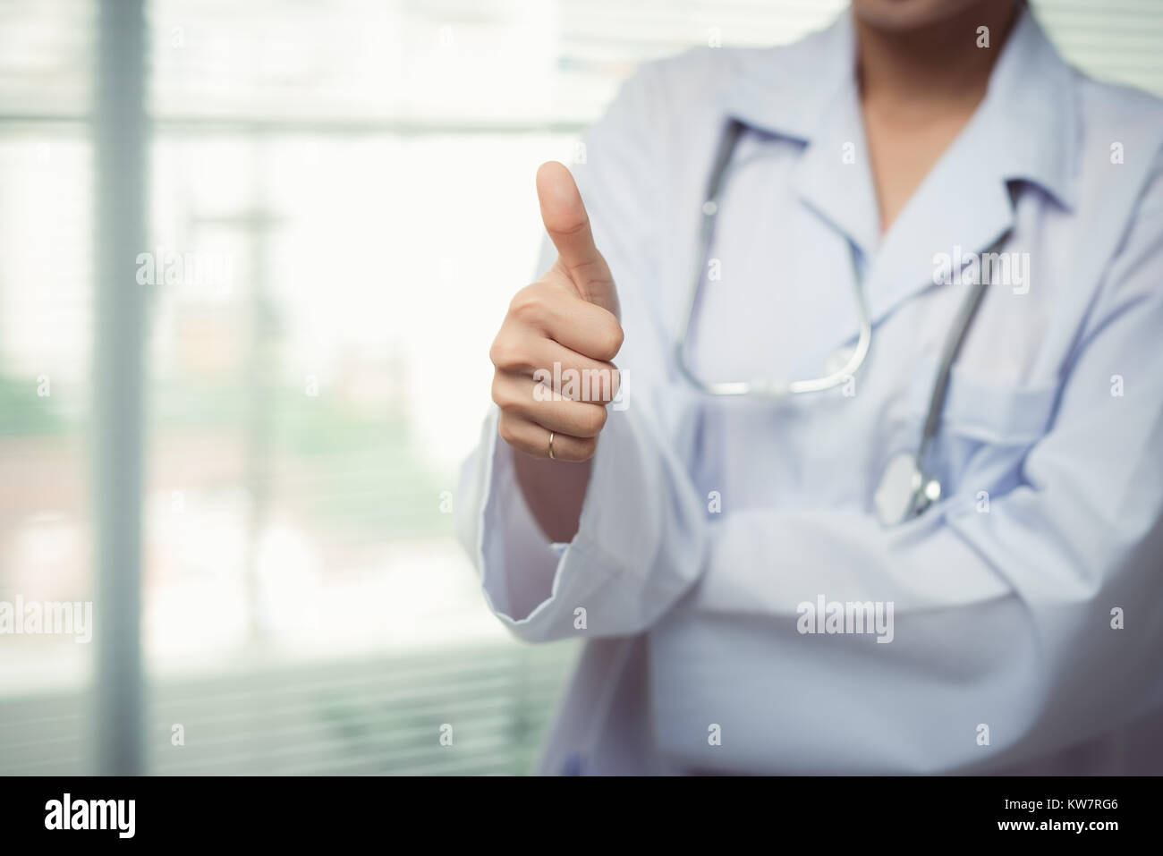 Female doctor hands with thumbs up gesture Stock Photo - Alamy