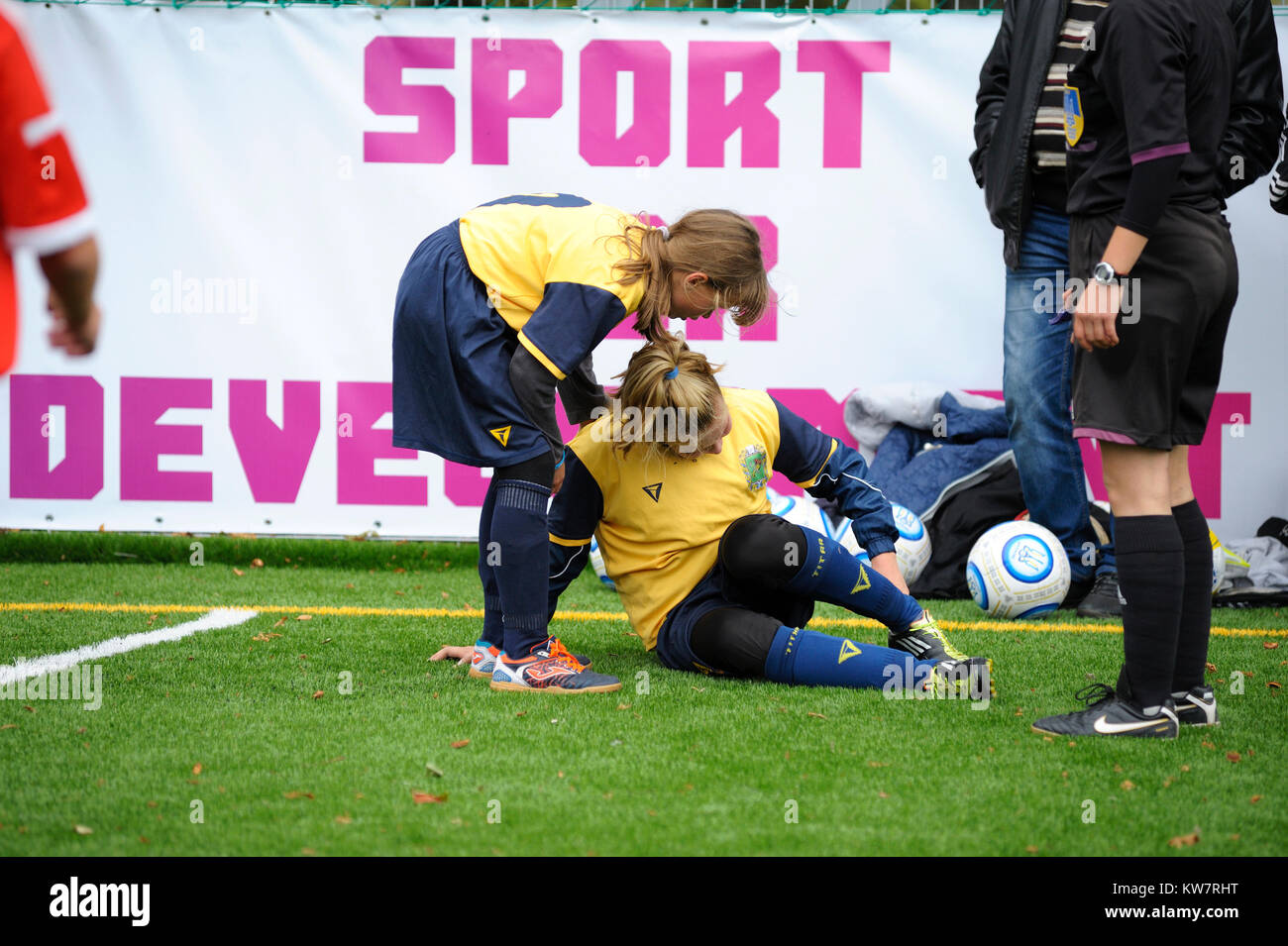 Girl football player helping her teammate. Football Girls Ukraine Cup ...