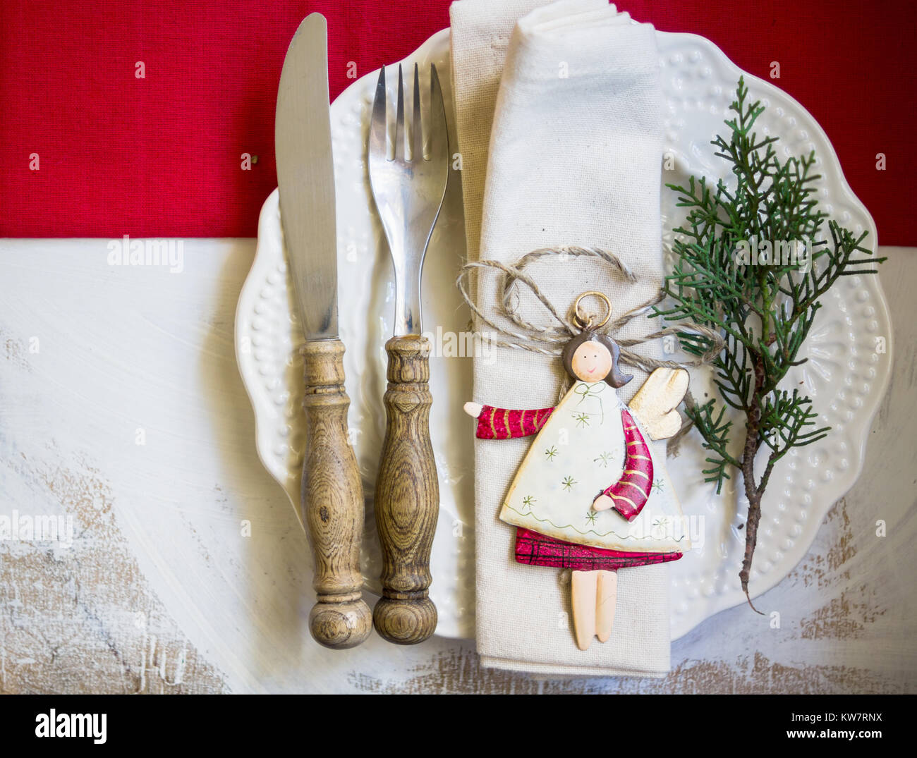 Christmas table setting with vintage silverware and angel decorations ...