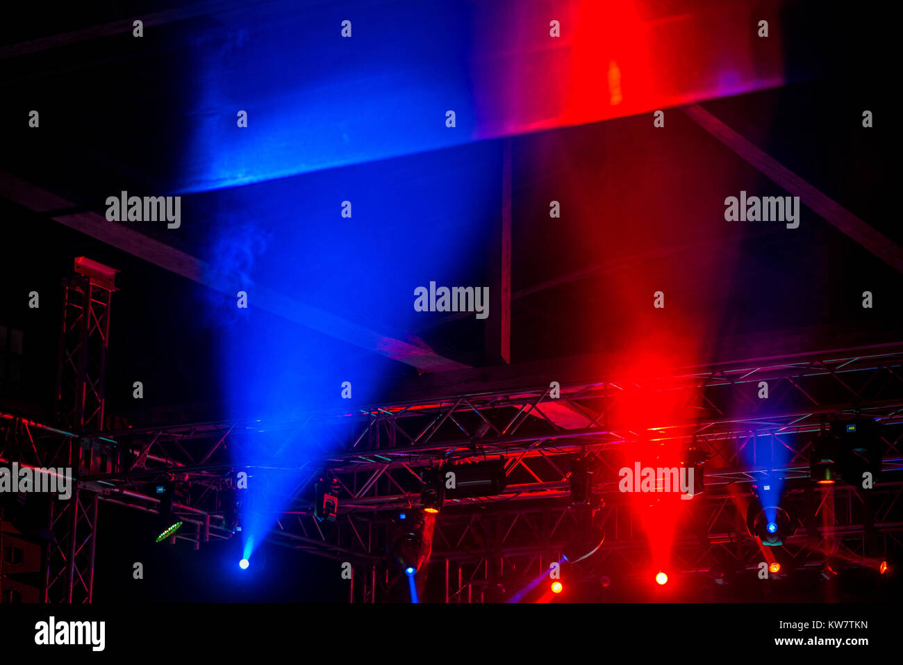 Stage lights and spotlights on metal construction during a concert ...