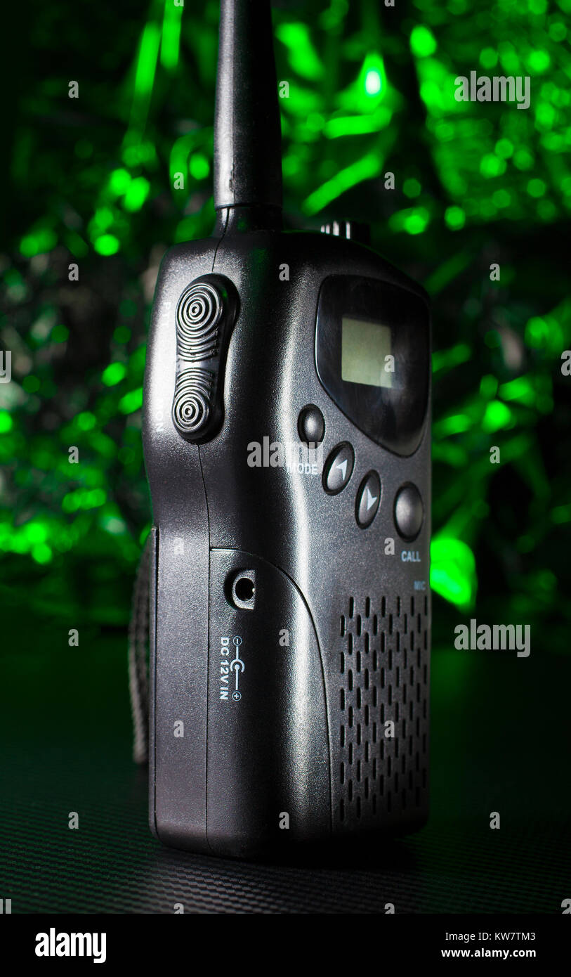 Green background with a vhf walkie talkie in front Stock Photo - Alamy