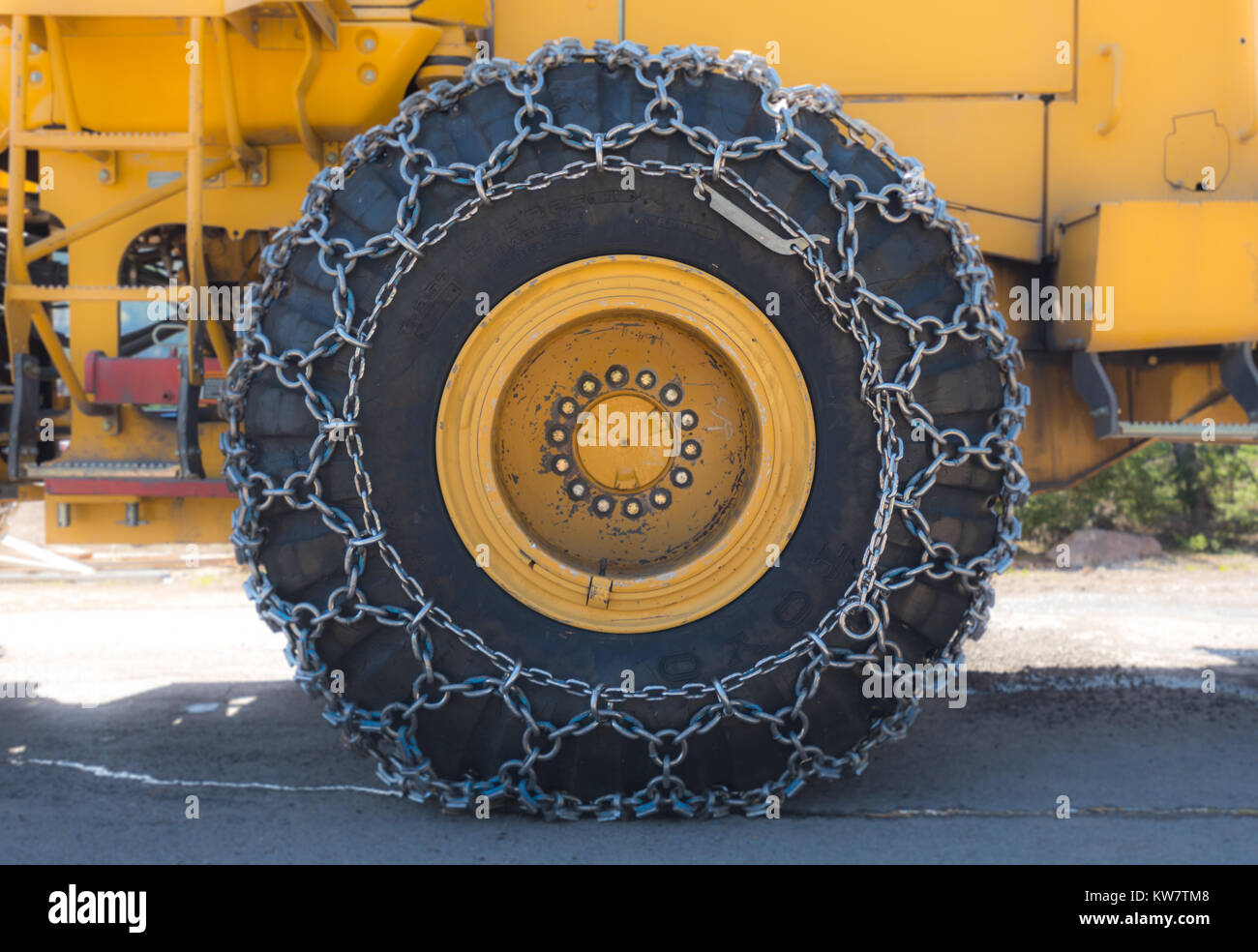 Snow Chains on Industrial Snow Blower Wheel in parking lot Stock Photo ...