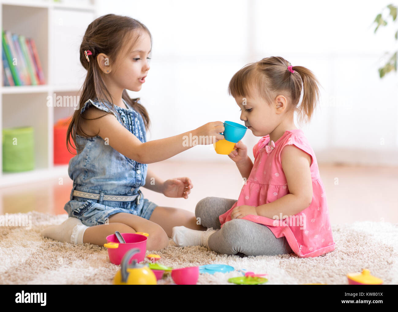 Little happy children, cute toddler and kid girls play with plastic toy ...