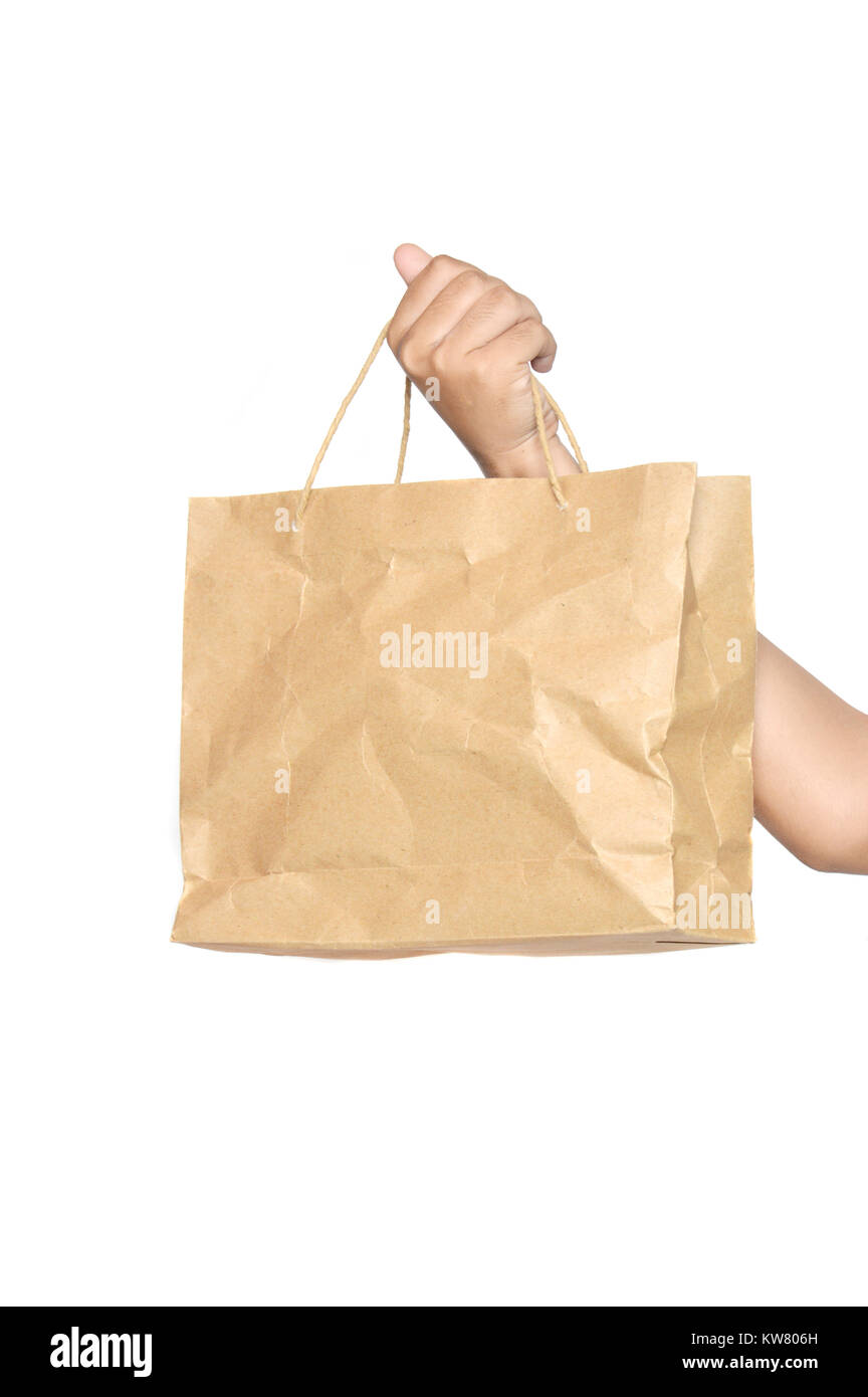 women hand hold paper bag on white background Stock Photo - Alamy
