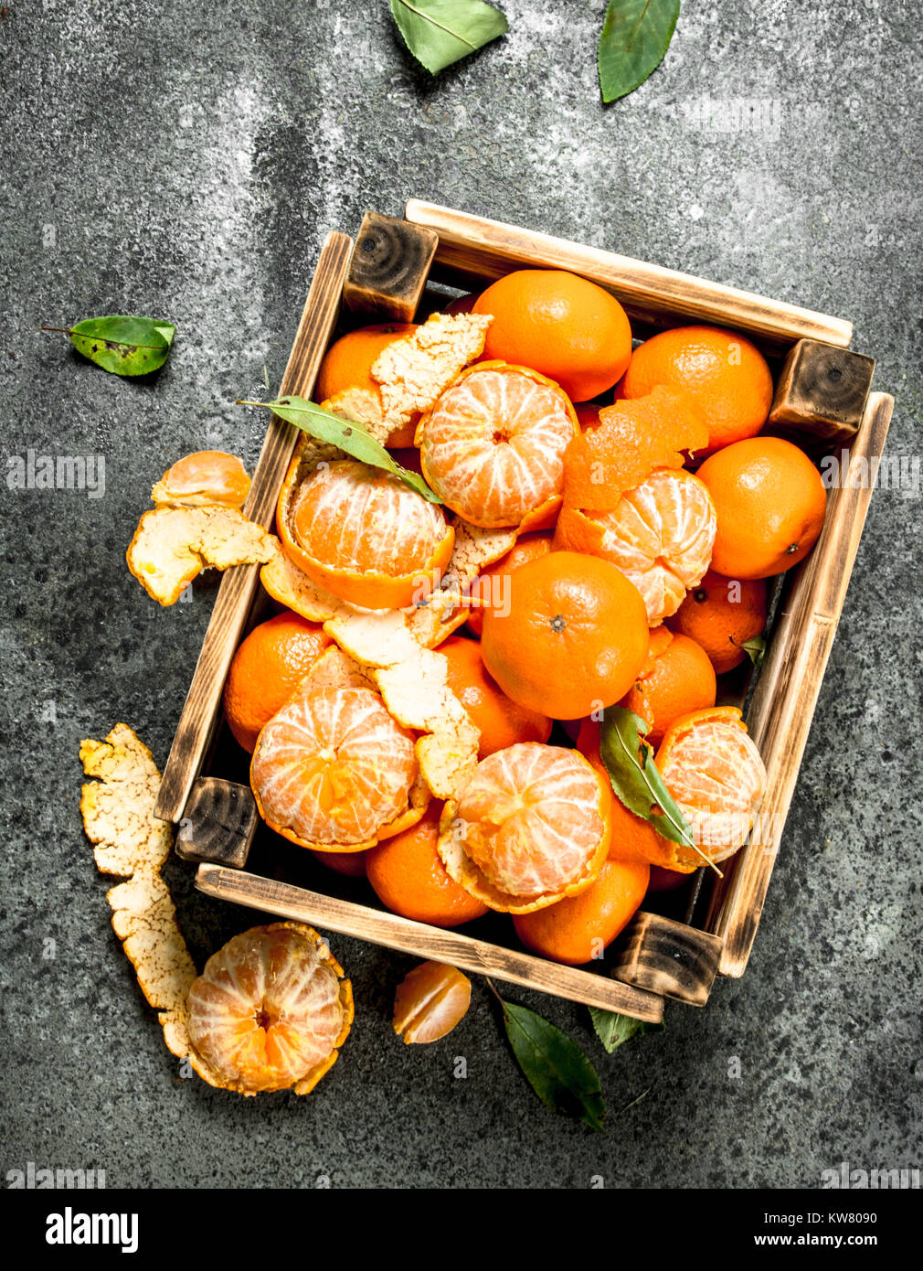 Fresh mandarins in an old box. On a rustic background Stock Photo - Alamy