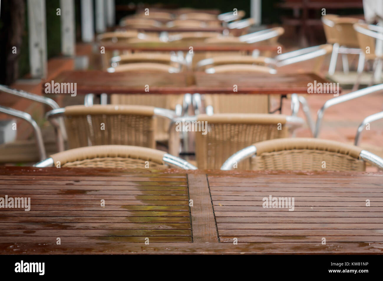 Tables and chairs on a terrace from the restaurant Stock Photo - Alamy